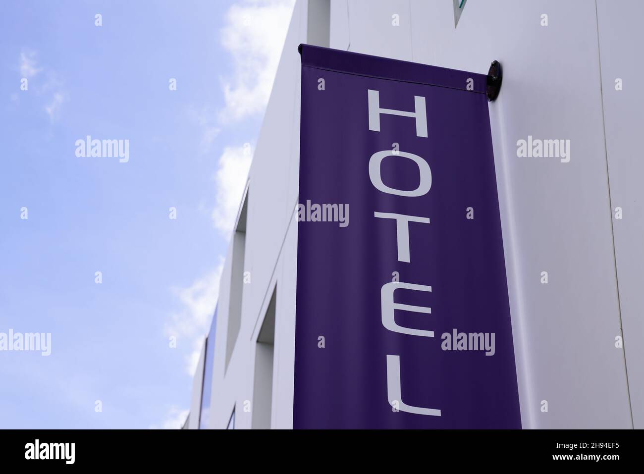 Hotel sign text on wall facade city building in french tourist town ...