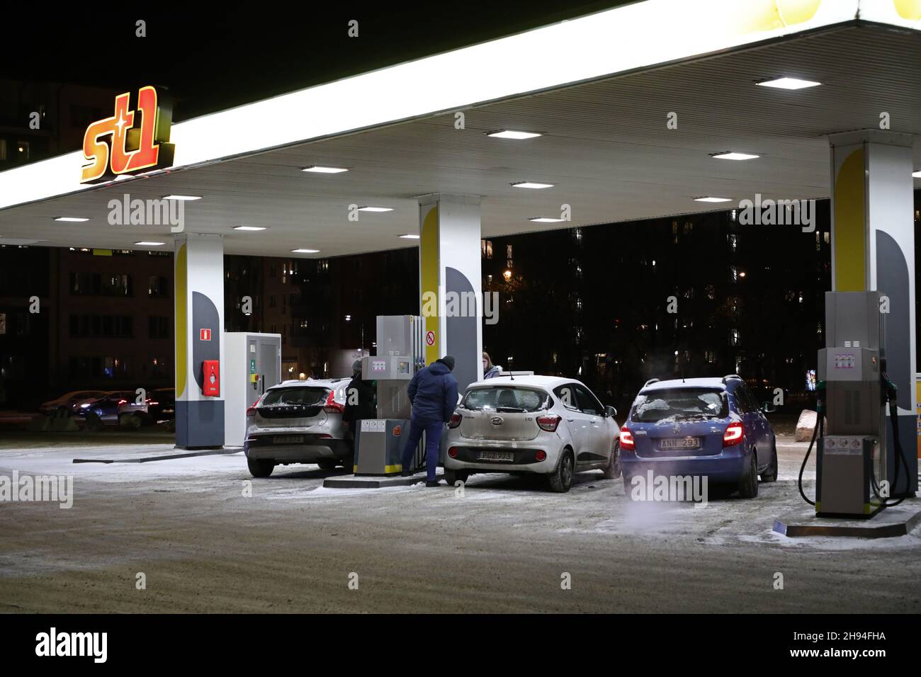 Daily life in Uppsala, Sweden, during Friday. Cars at a gas station ...