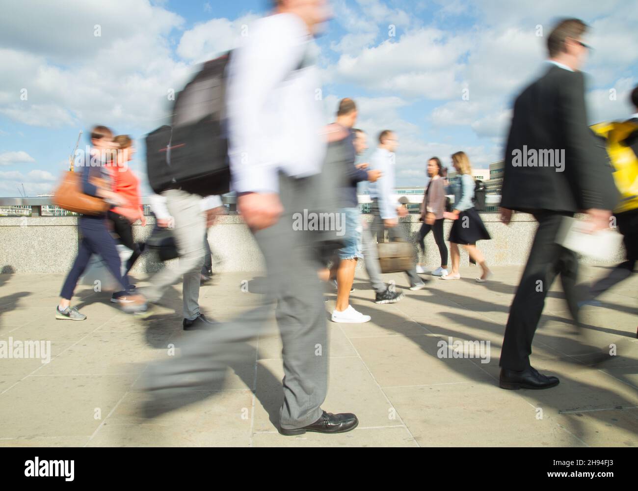 City workers walk across London Bridge at the end of the working day on ...