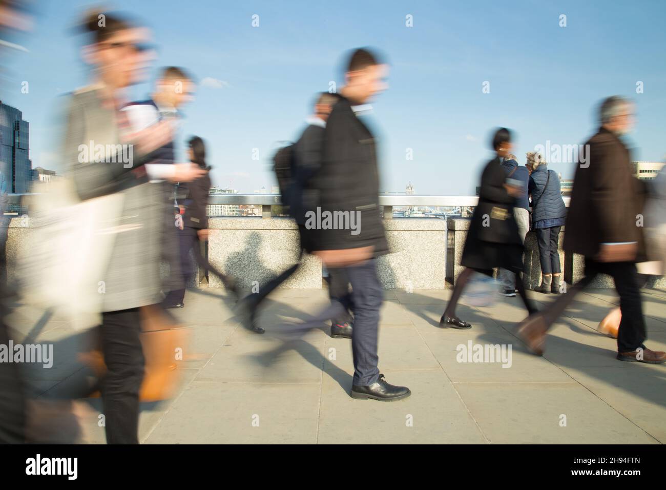 City workers walk across London Bridge at the end of the working day on ...