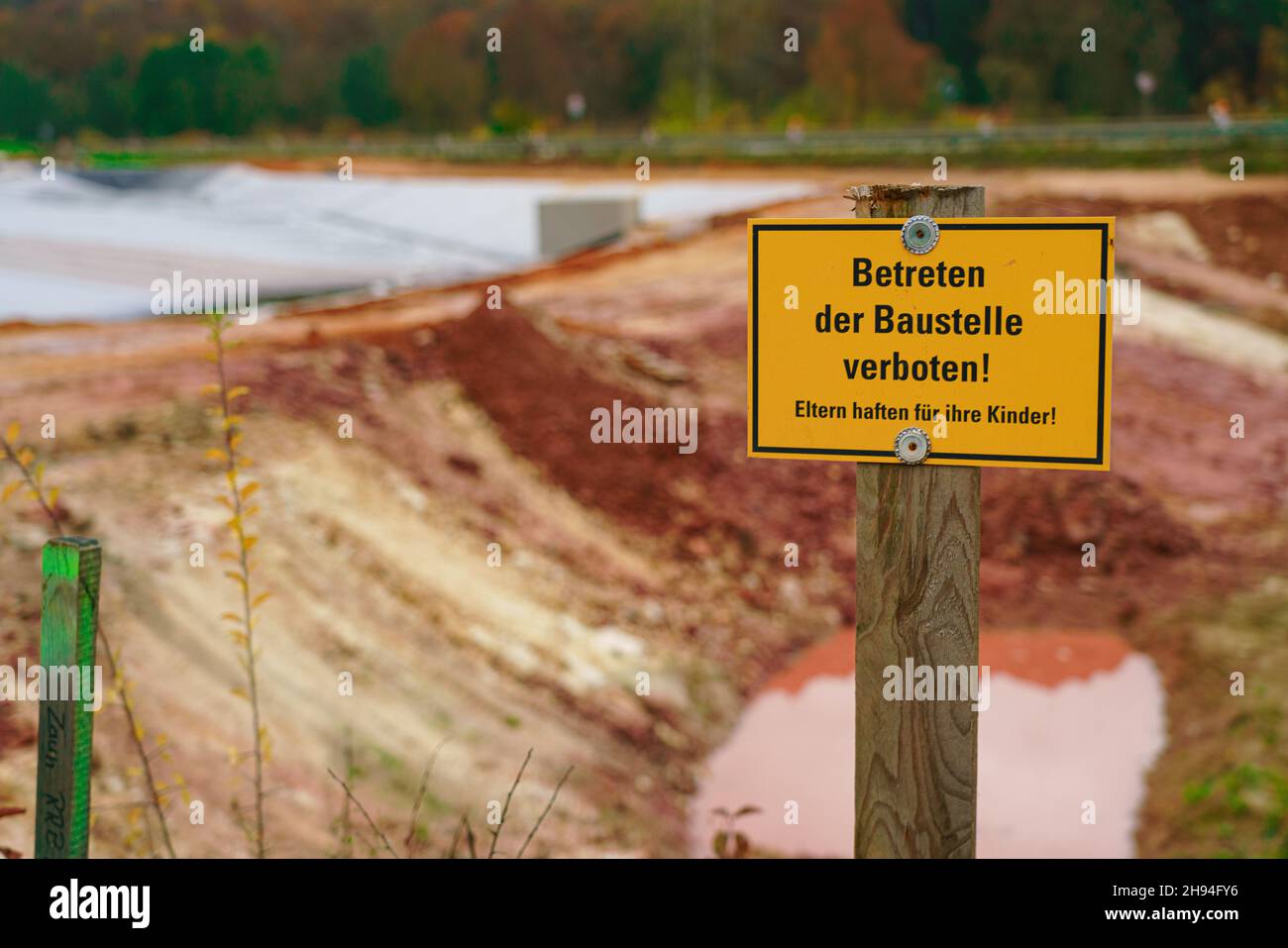 Shot of a yellow sign with written "enter the forbidden construction ...