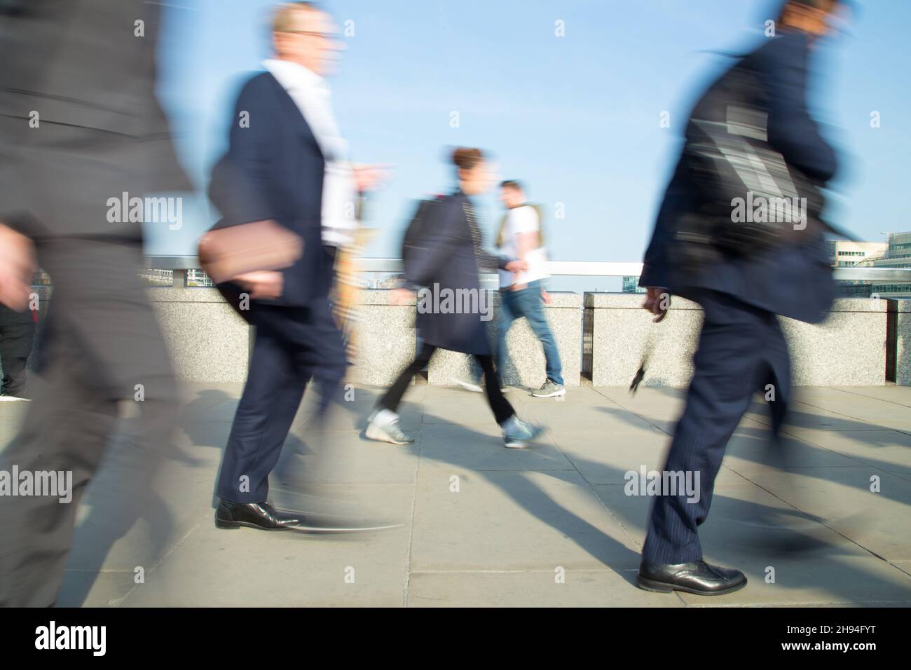 City workers walk across London Bridge at the end of the working day on ...