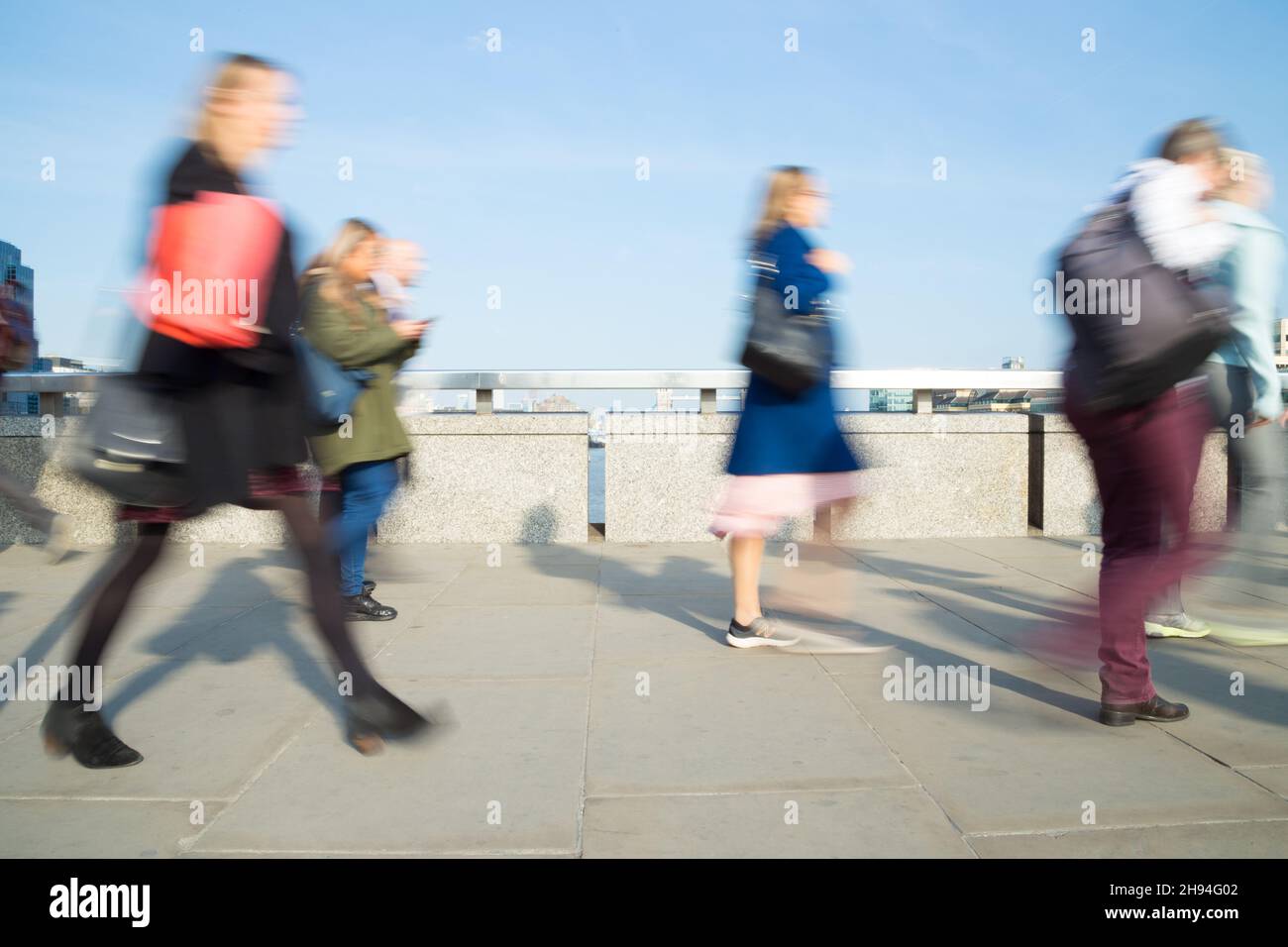City workers walk across London Bridge at the end of the working day on ...