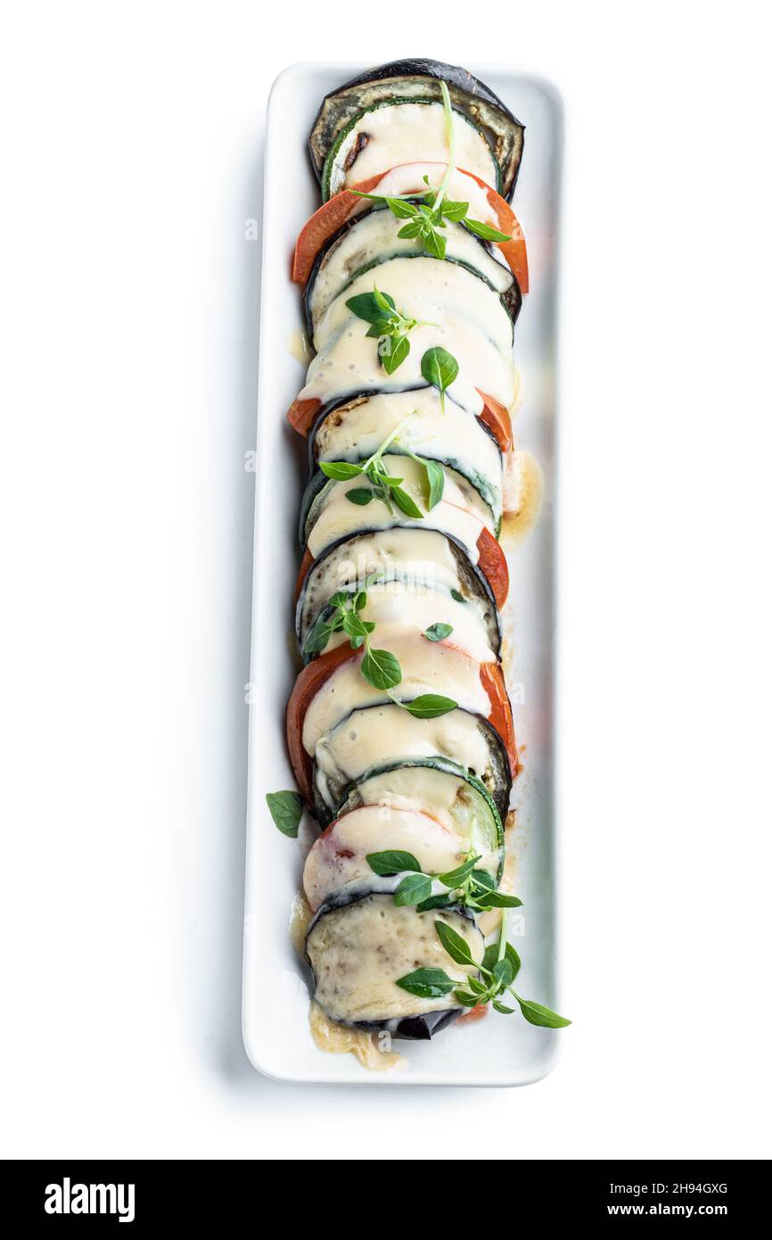 Baked vegetables with cheese and greek basil isolated on white Stock ...