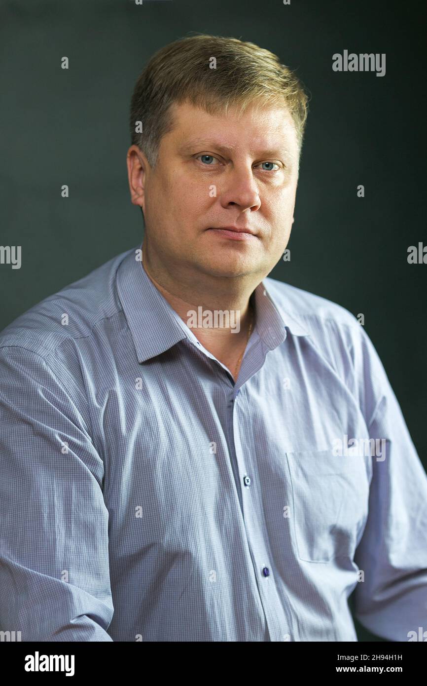 Portrait of an adult male lawyer black background in a blue shirt Stock ...