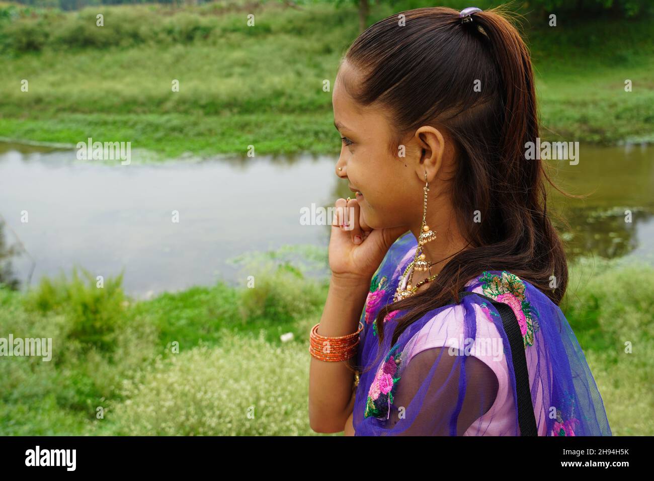 A cute girl watching the view Stock Photo - Alamy