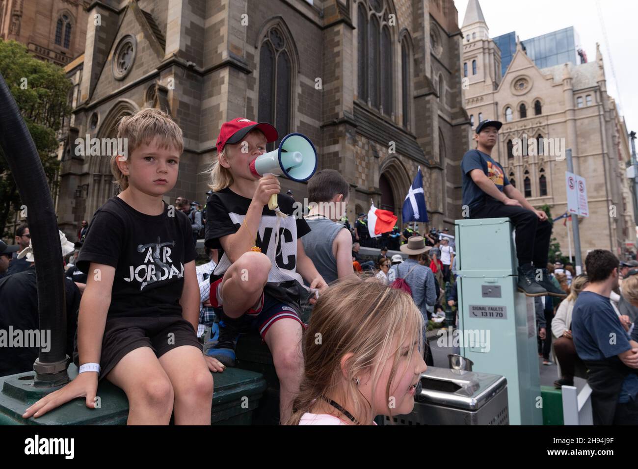 Melbourne, Australia, 4 December, 2021. Children chant with a small ...