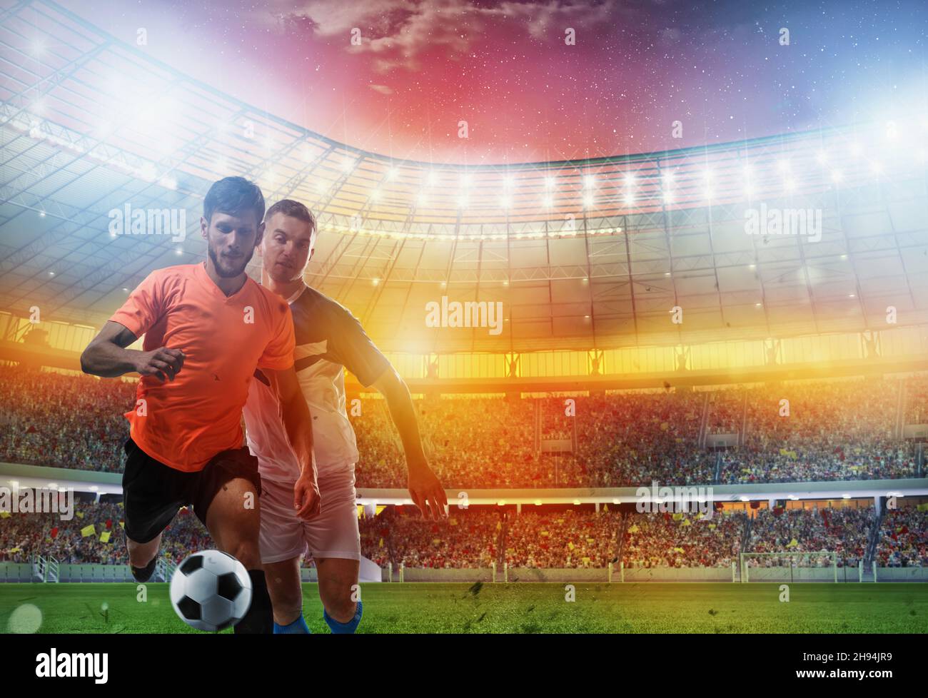 Soccer players play with soccerbal at the stadium Stock Photo - Alamy