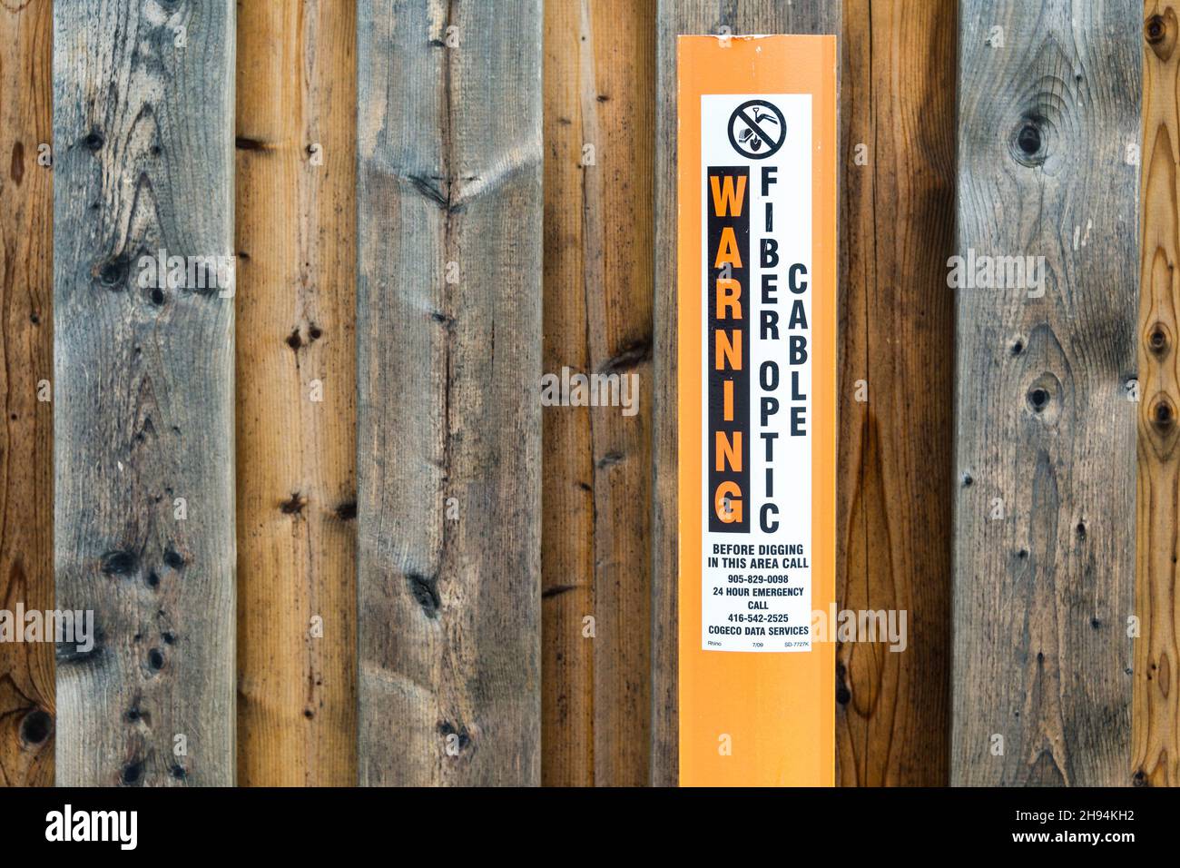 Sign warning the presence of fiber optic cable below the ground.Nov. 22 ...