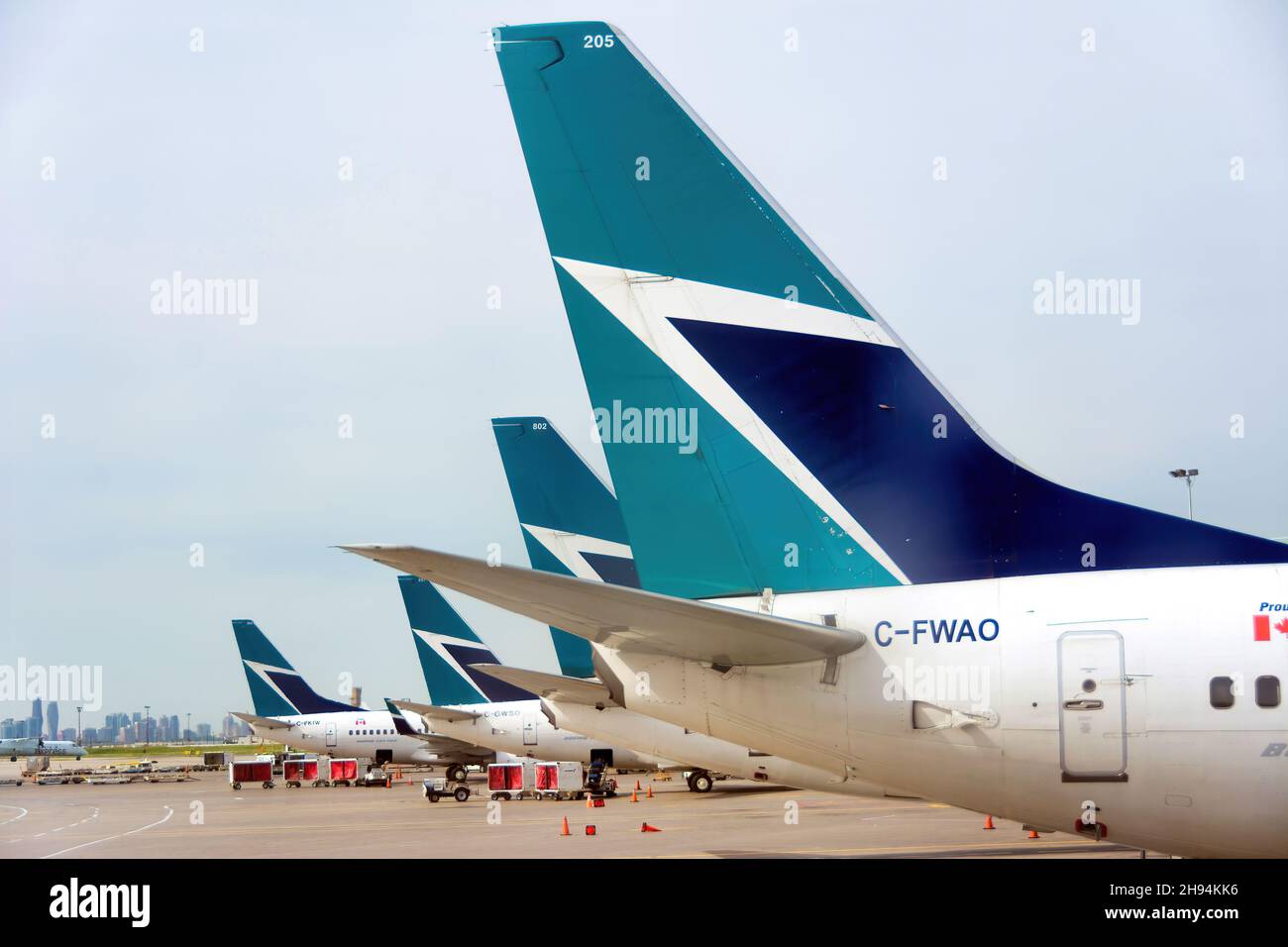 Westjet plane tails in Pearson International Airport. Westjet is an ...