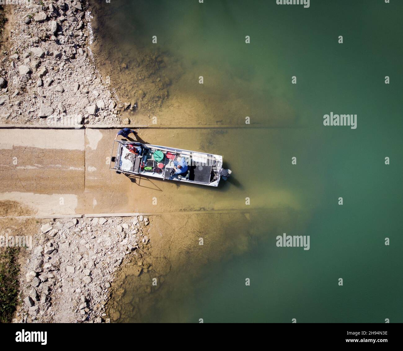 Beautiful top view shot of a small boat launching on the shore Stock ...