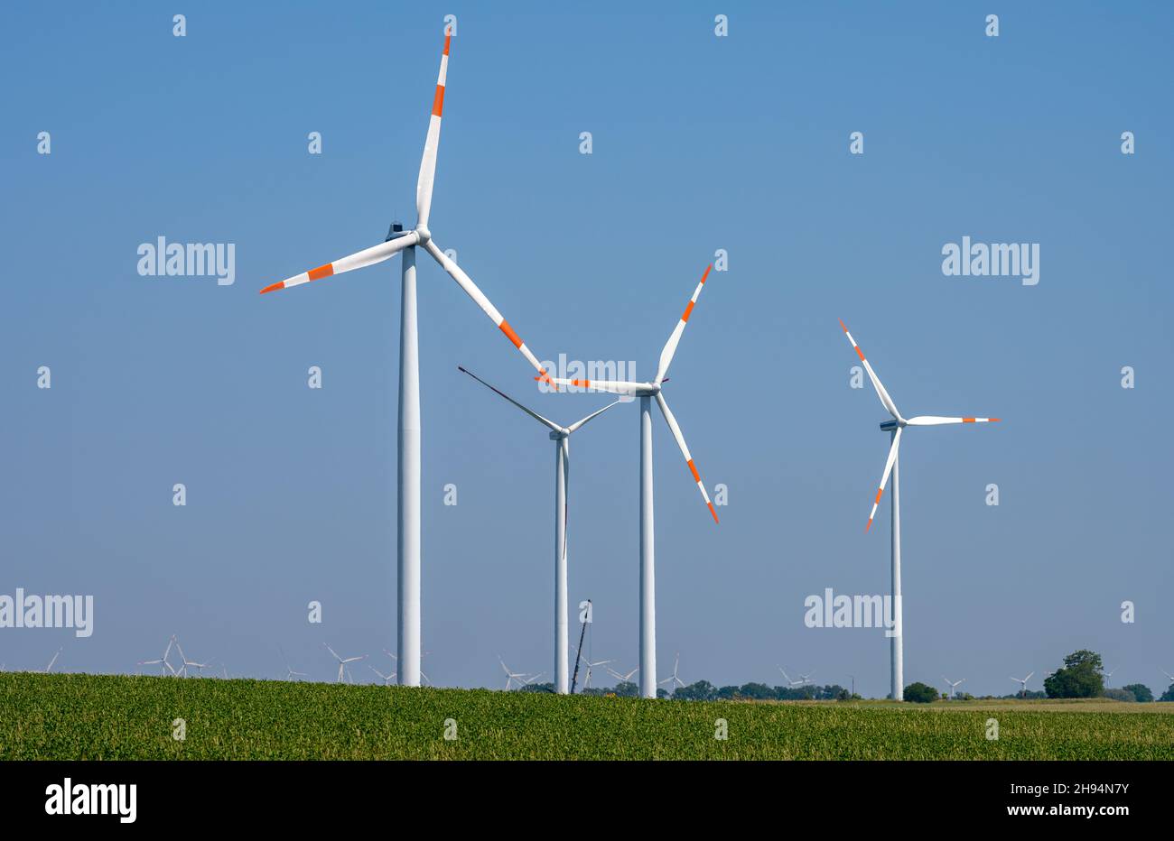 Modern wind power turbines with a clear blue sky seen in Germany Stock ...
