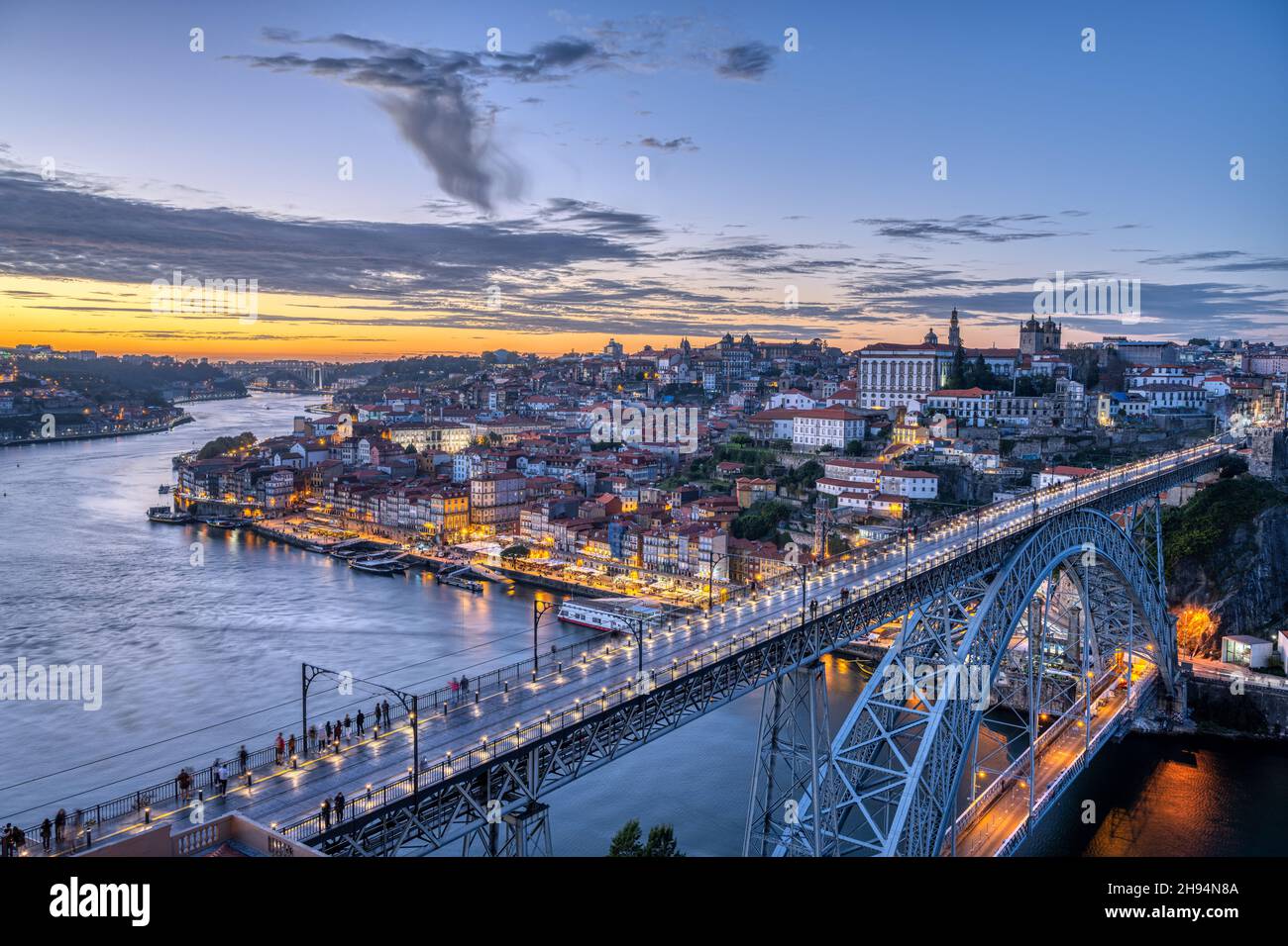 View of Porto with the famous iron bridge and the river Douro after ...