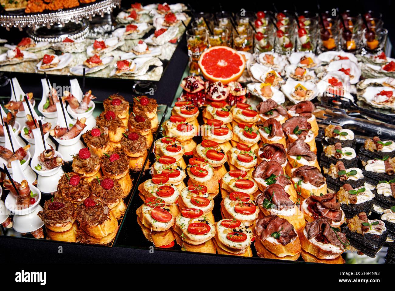 Catering services with snacks on guests table in the restaurant at the ...