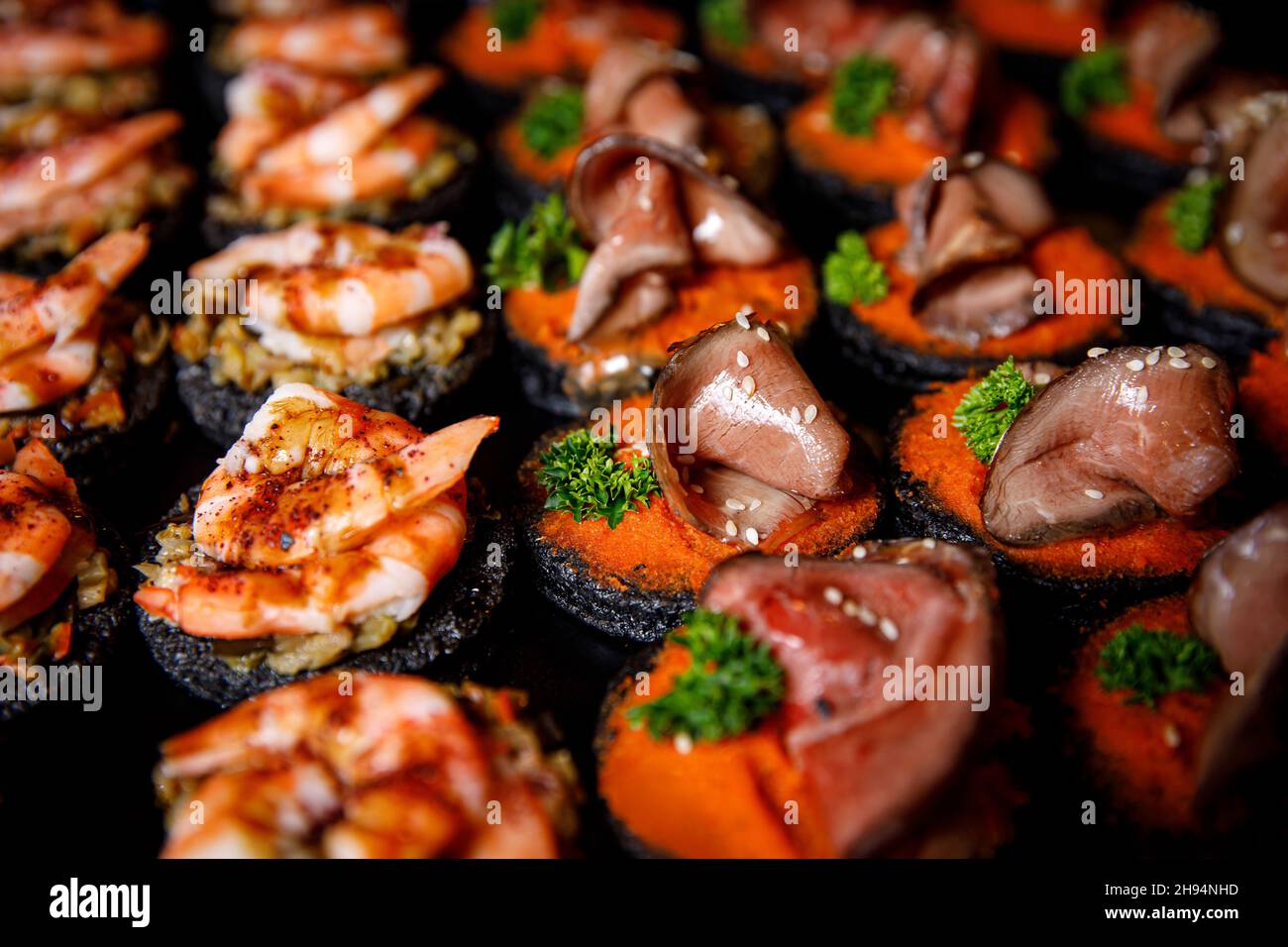 Banquet Meat Bar. Cold snacks with vegetables, fish and rucola on bread ...
