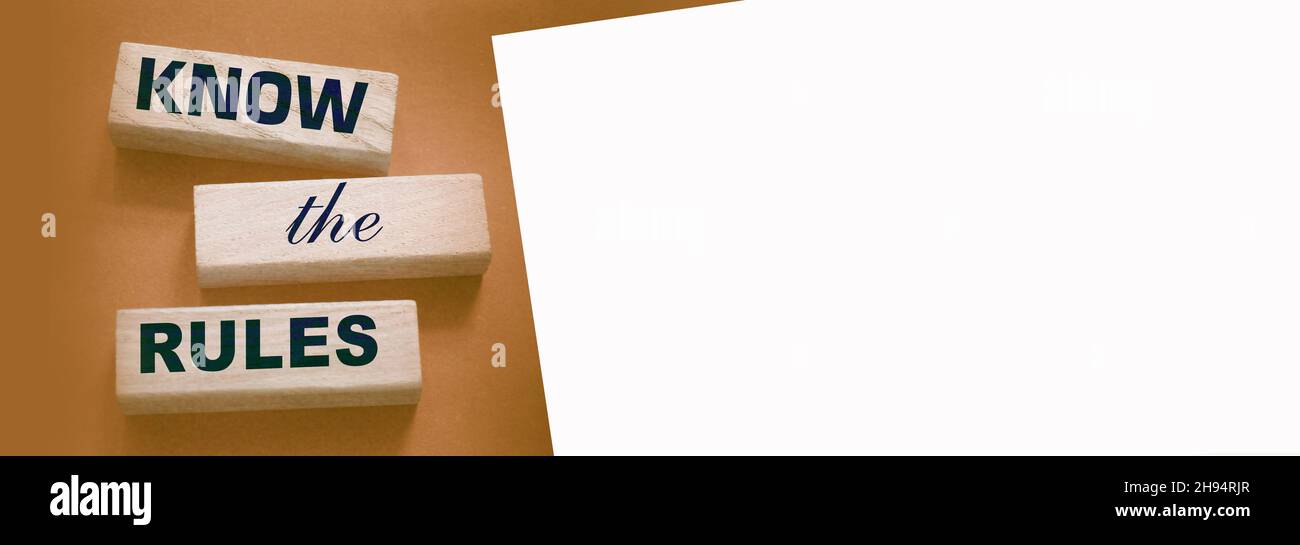 Know the rules word on wooden blocks isolated on dark grey background ...
