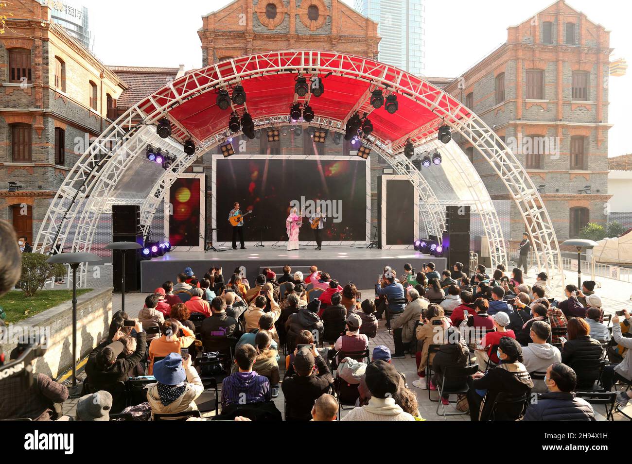 Shanghai. 4th Dec, 2021. Residents enjoy a concert at an alley during ...