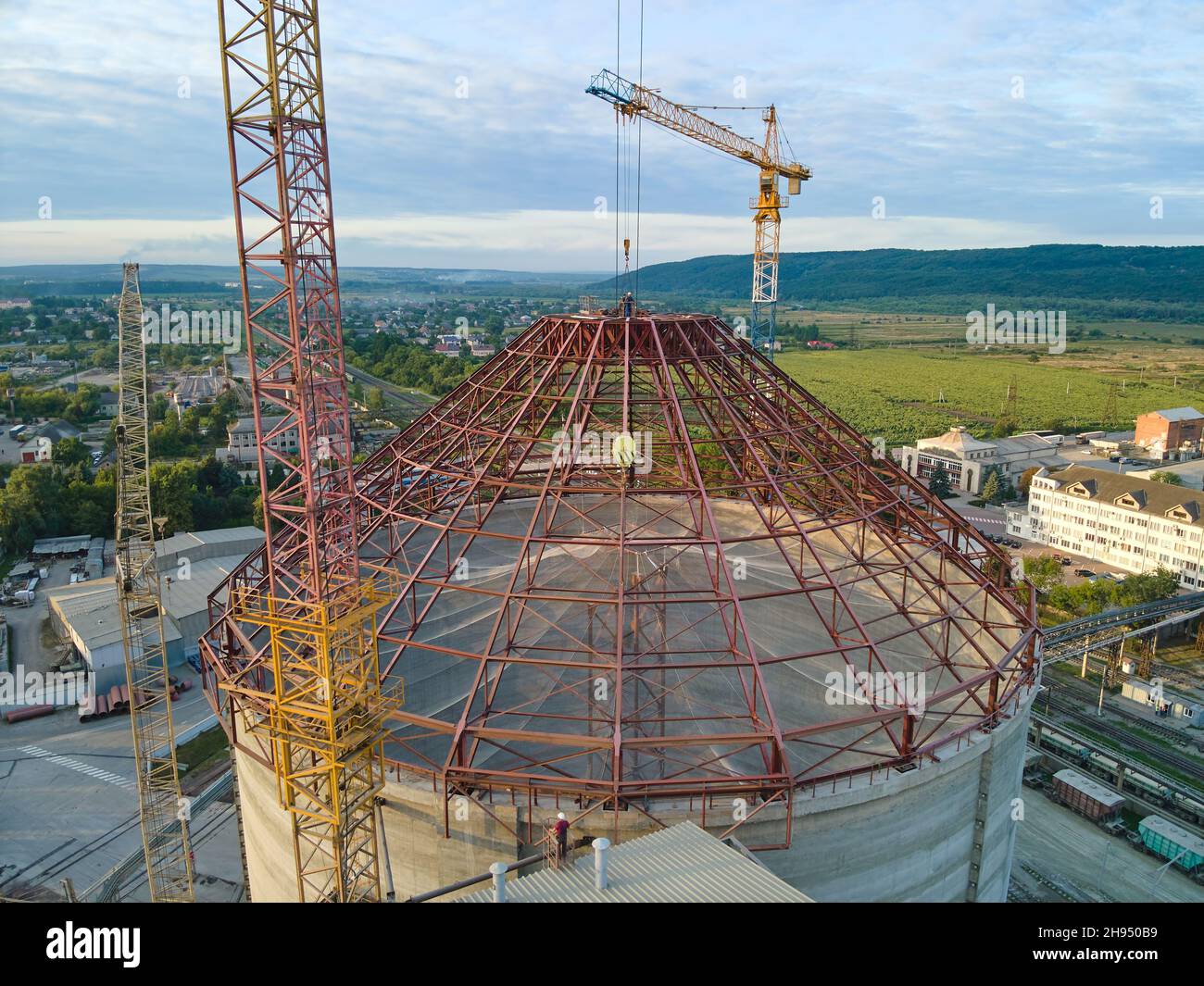 Aerial view of cement factory under construction with high concrete ...