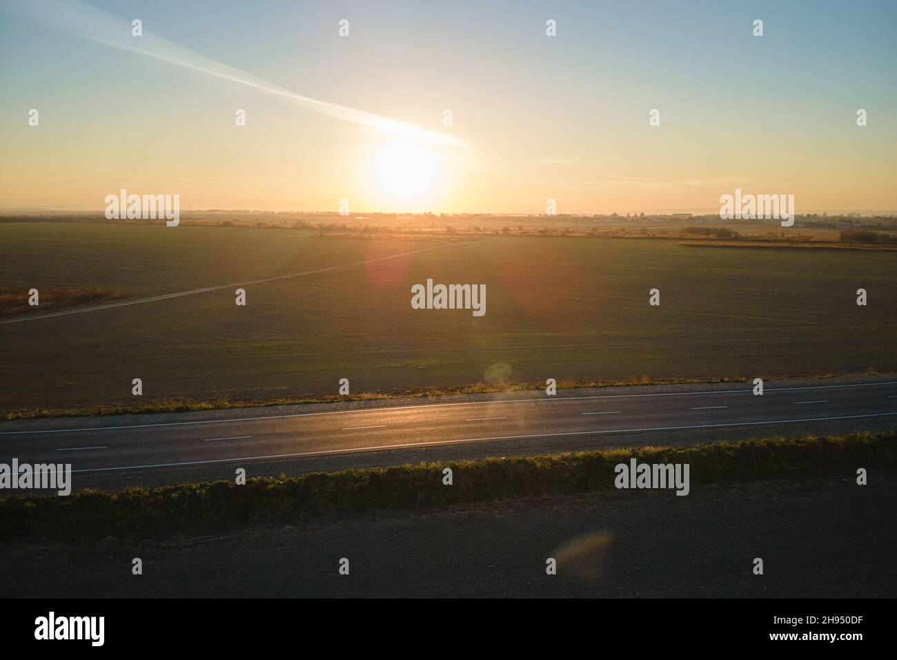 Aerial view of empty intercity road at sunset. Top view from drone of ...