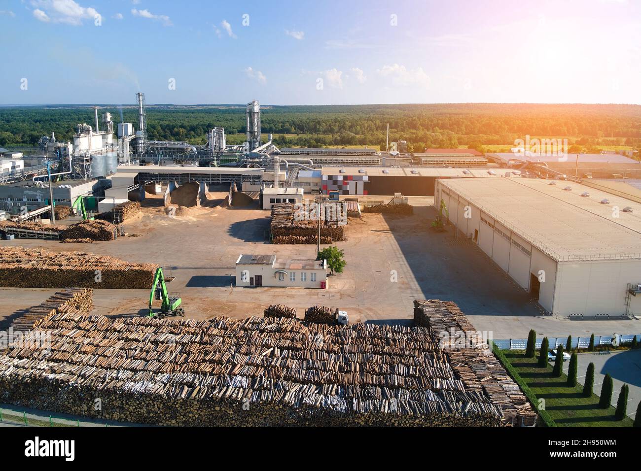 Aerial view of wood processing factory with stacks of lumber at plant ...