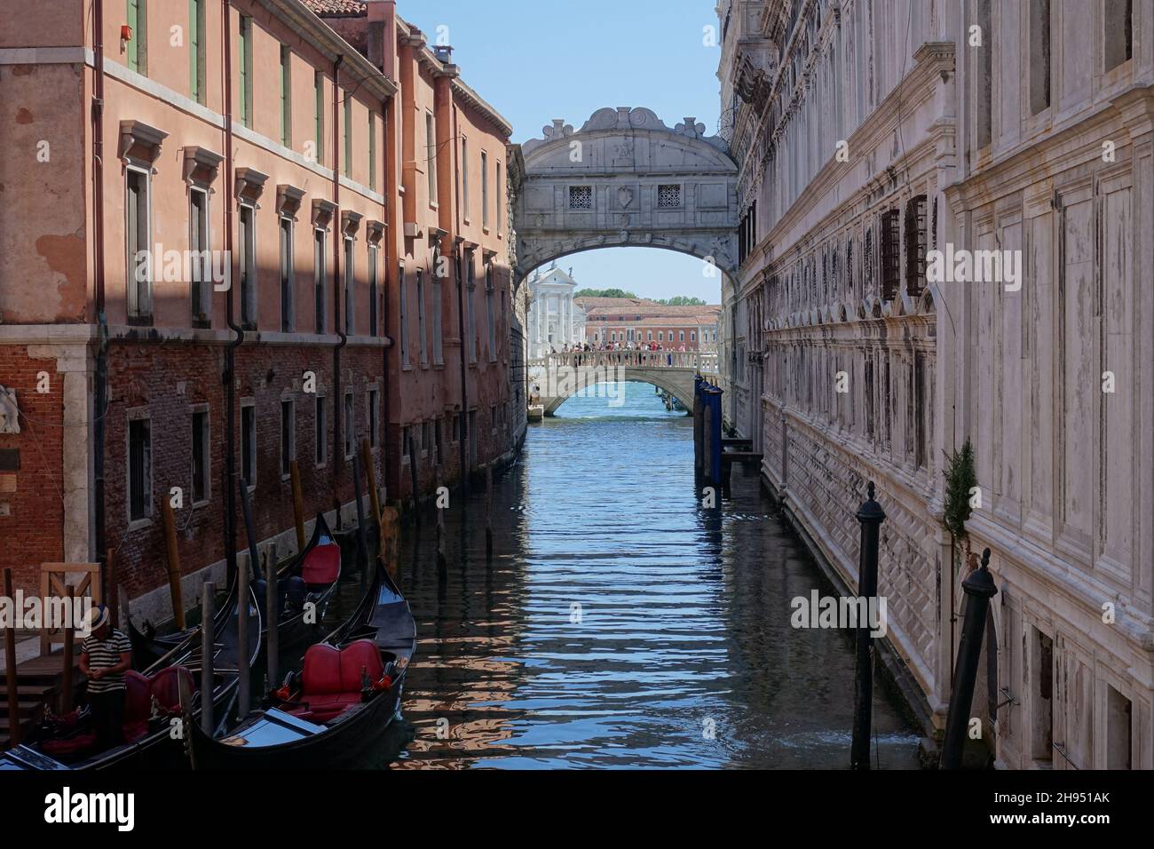 Old Canal with a typical gondola in the center of Venice, a romantic ...