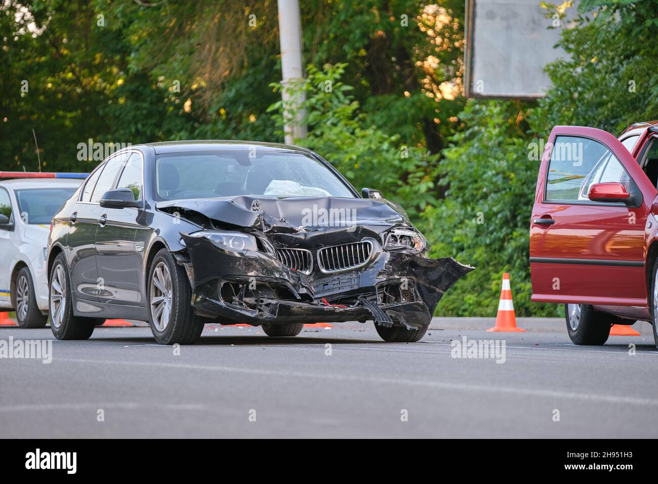 Damaged in heavy car accident vehicles after collision on city street ...