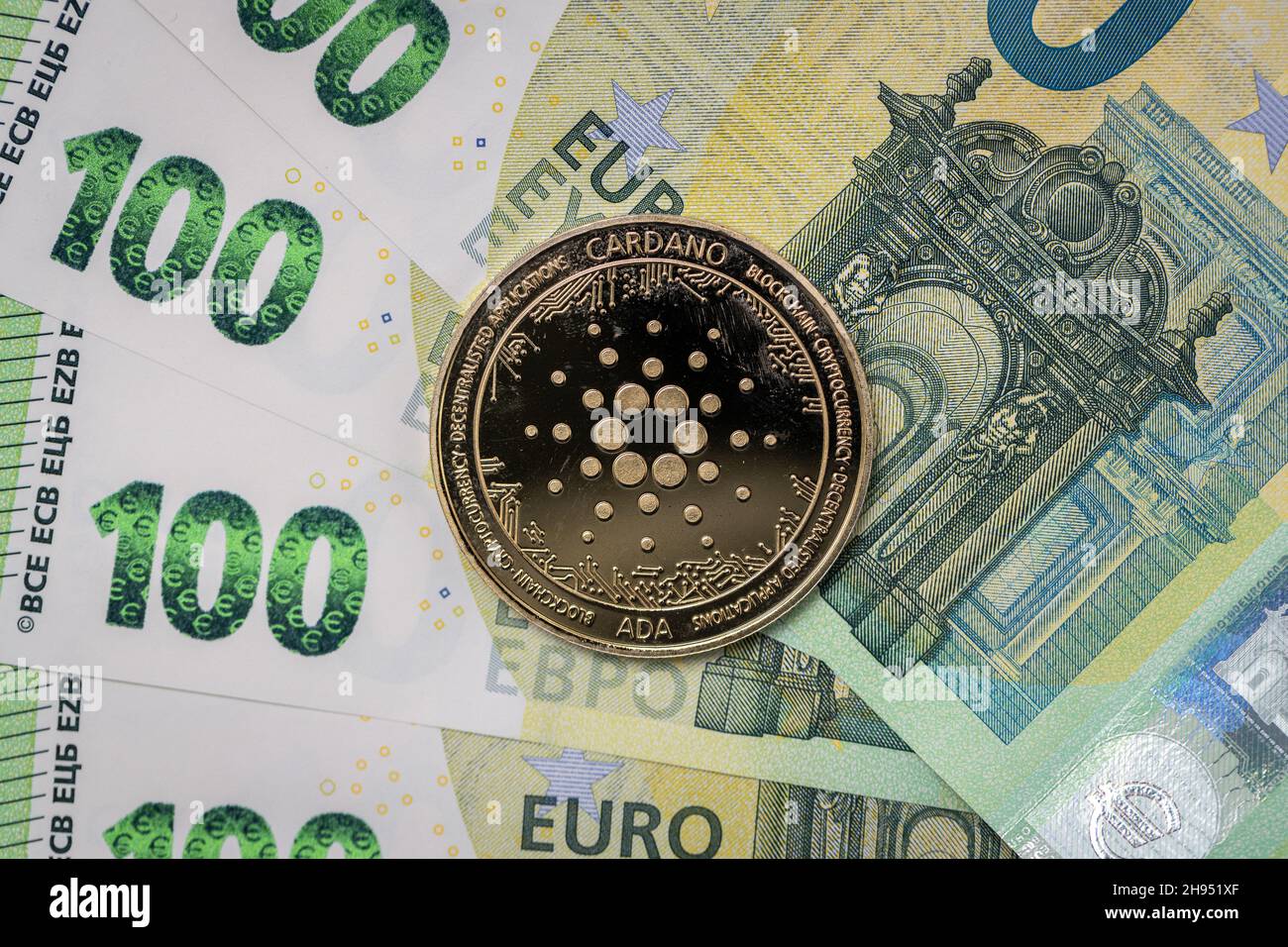 Cardano Ada physical coin laying on top of 100 Euro bills Stock Photo ...