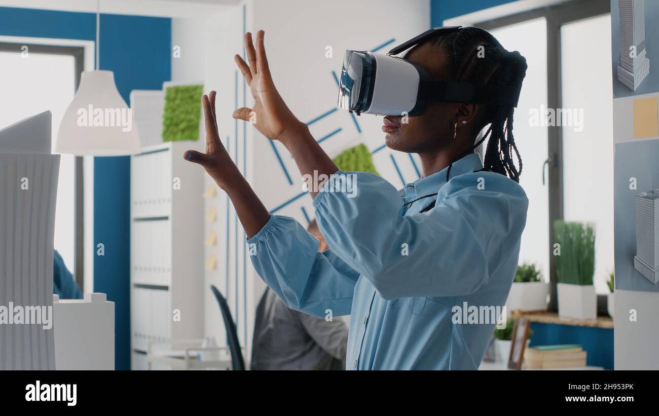 Woman architect working with vr glasses to design 3d building model for ...