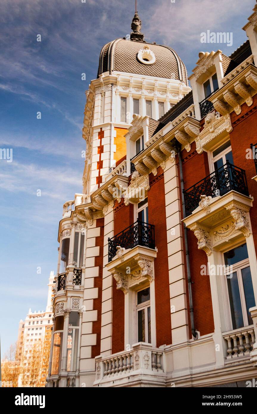 Madrid domed tower, carved window pediments and corner glass porches ...