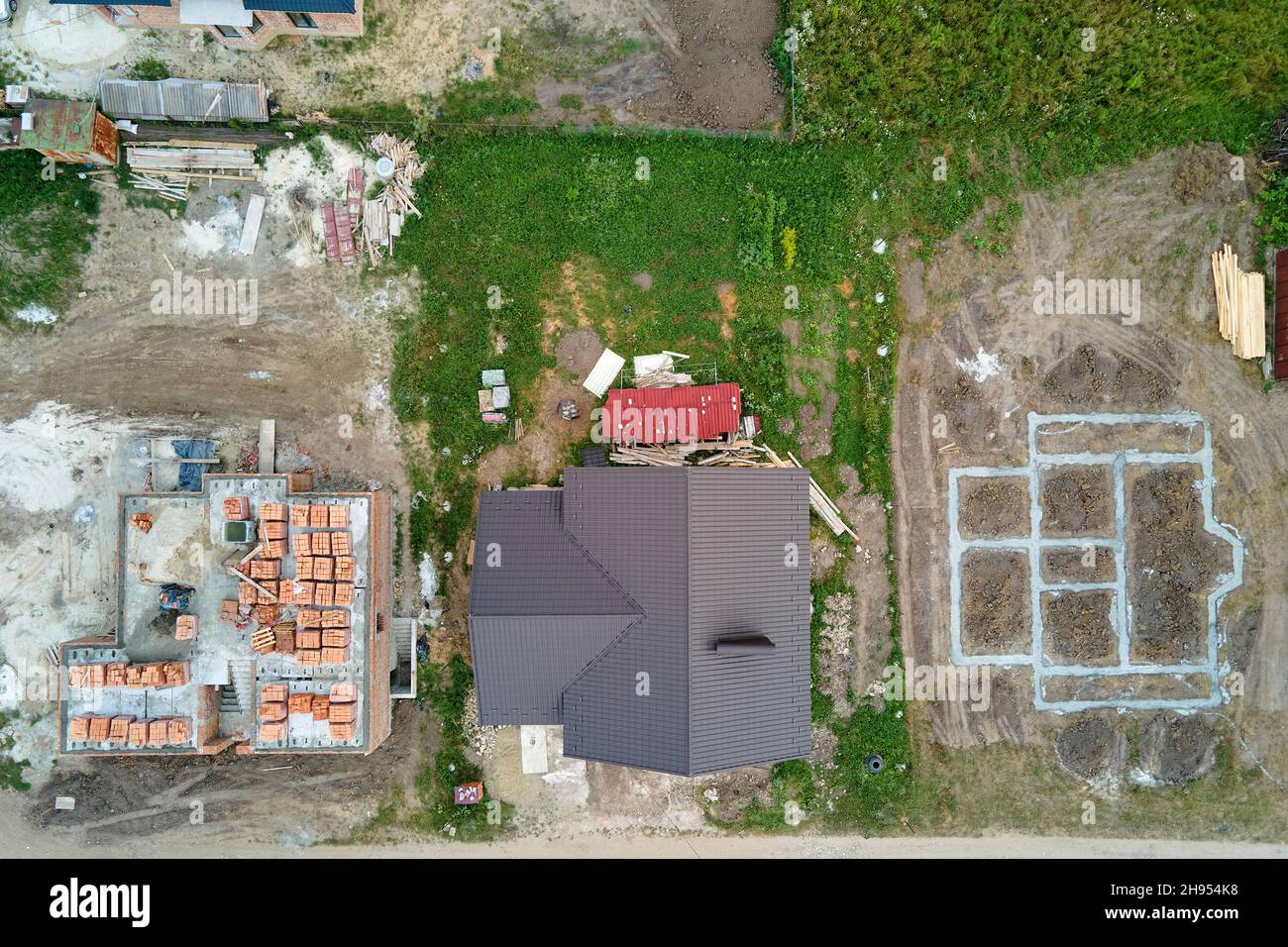 Top down aerial view of building works of new house concrete foundation ...
