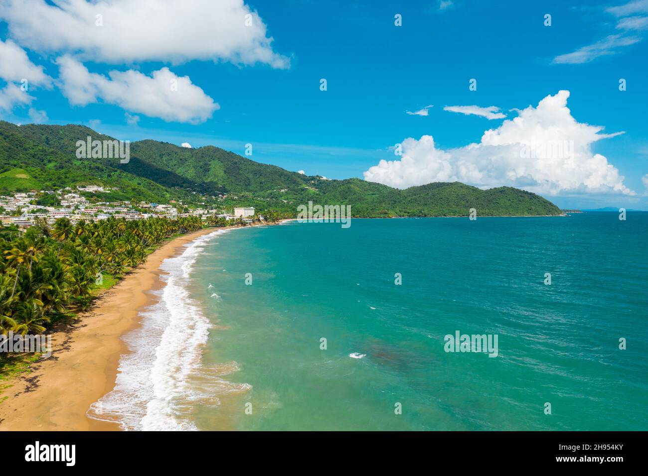 Aerial view of a beautiful beach in Maunabo, Puerto Rico against a ...