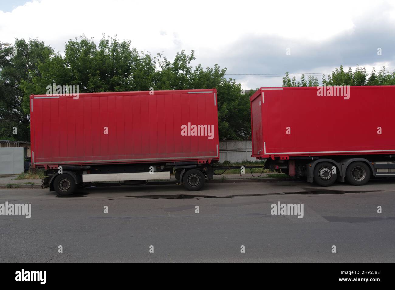 Red auto trailers. Food delivery in red containers. Delivery of goods ...