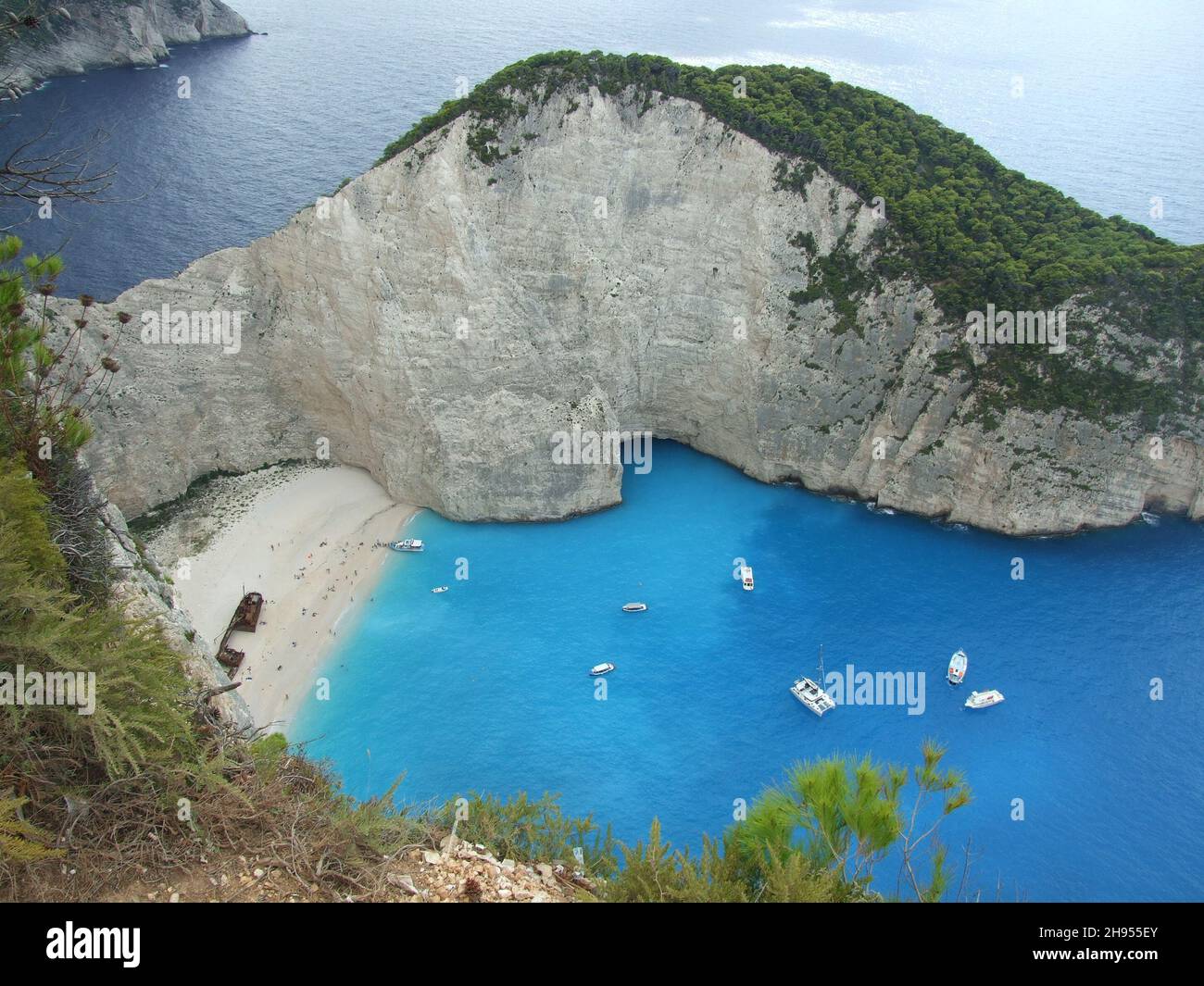 Aerial view of Navagio or Shipwreck beach with blue sea and cliffs on ...