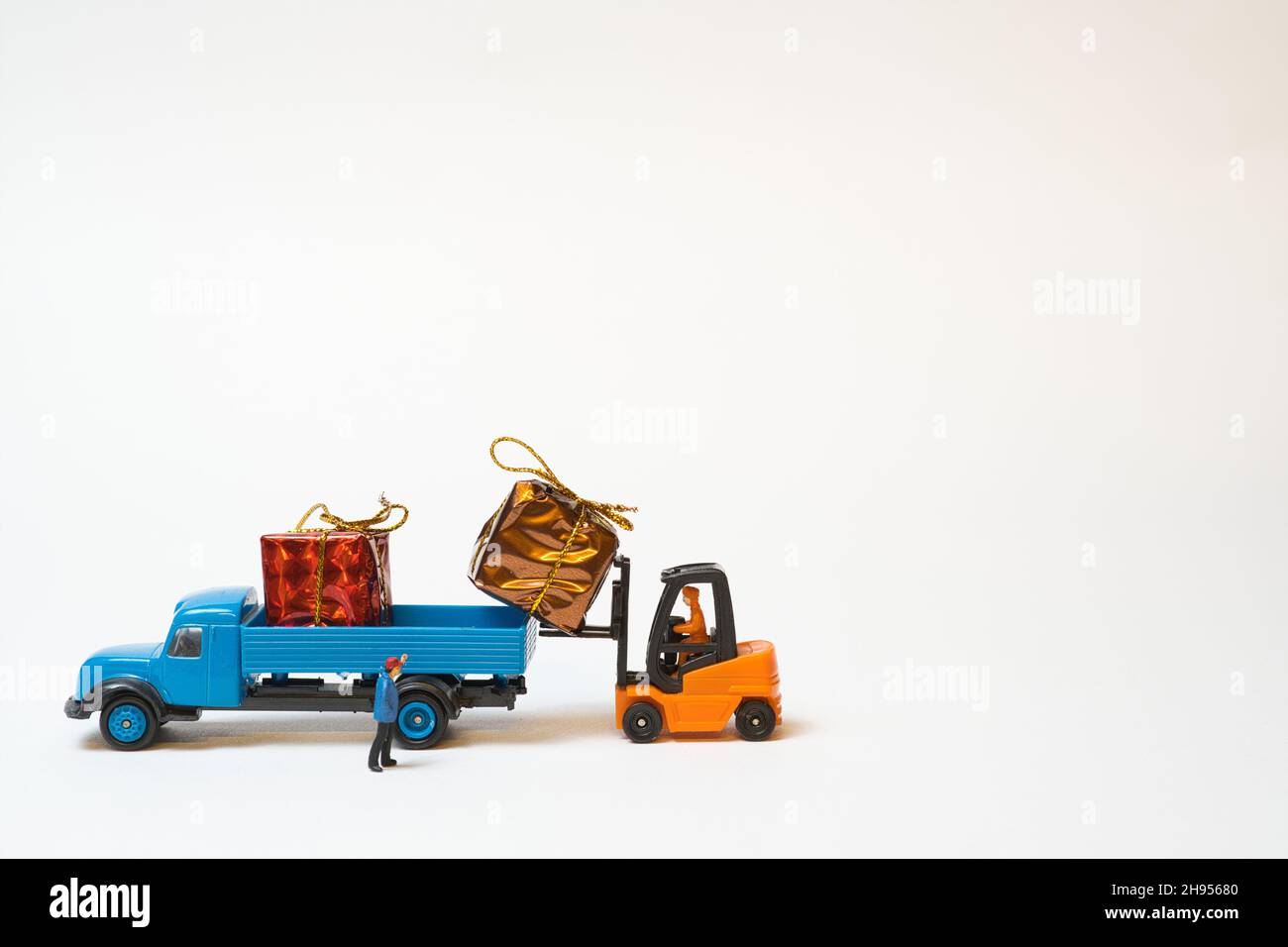Loading of a miniature truck with Christmas gifts with a forklift on a ...