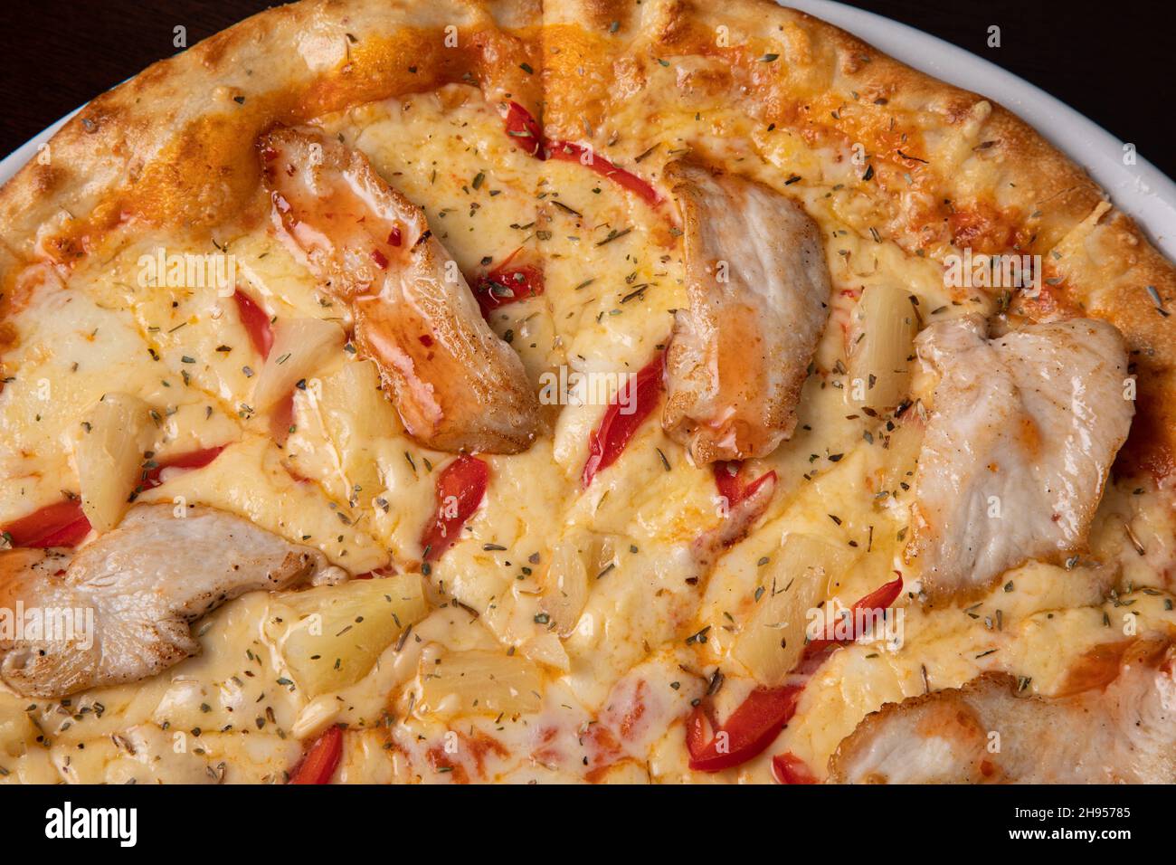 Pizza quattro stagioni four seasons pizza with cheese and chicken Stock ...