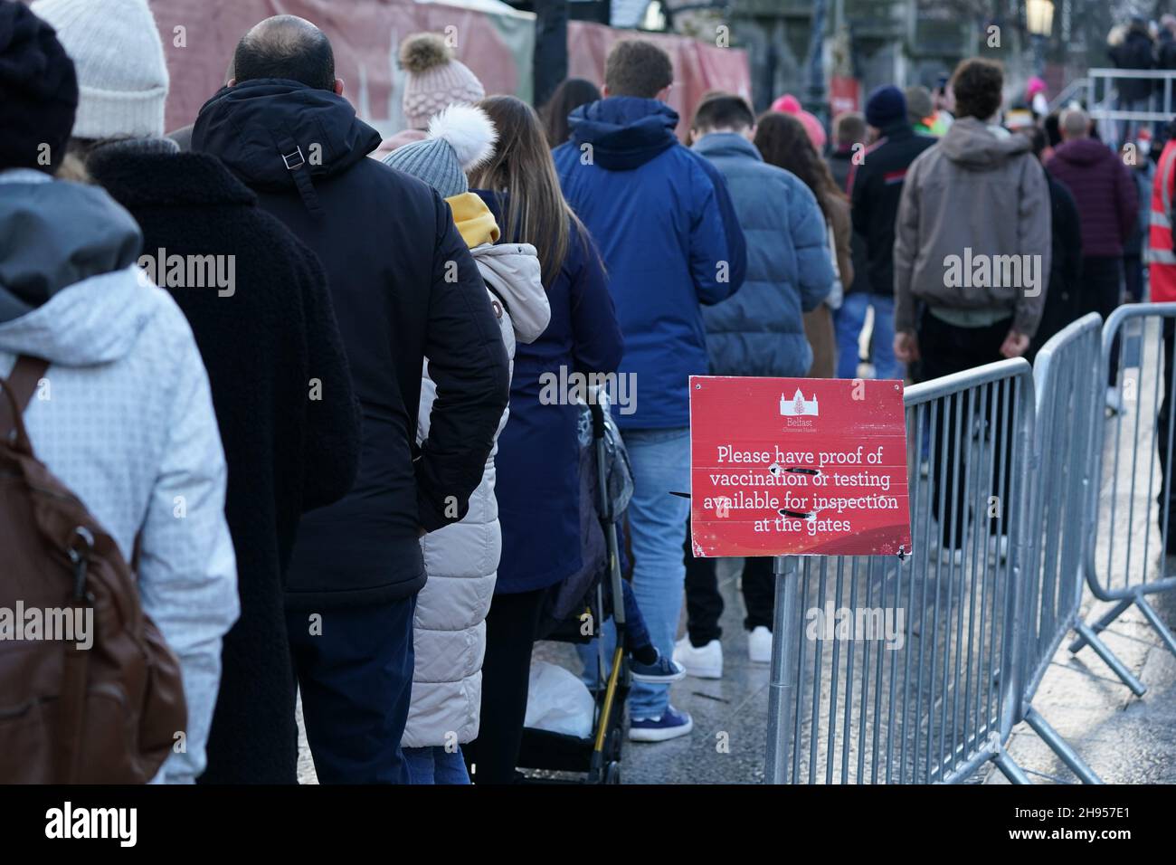 People queue to show their Covid certs to enter the Christmas market ...