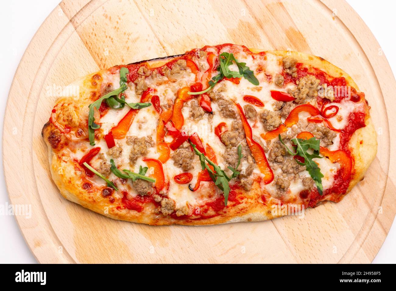 Delicious pizza served on wooden plate. Concept for advertising flyer ...