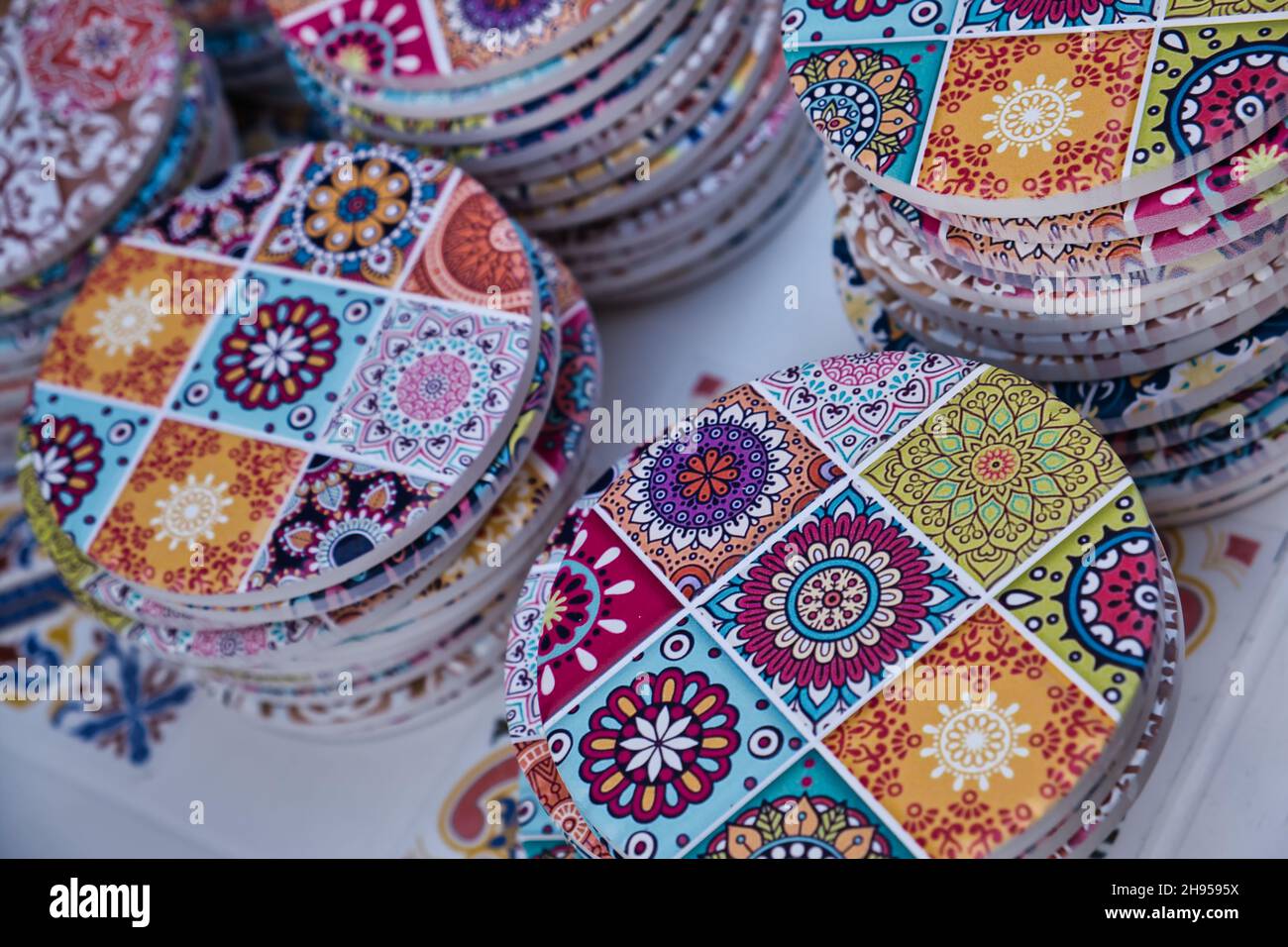 Bunch of colorful decorated coasters in a souvenir shop in Palermo ...