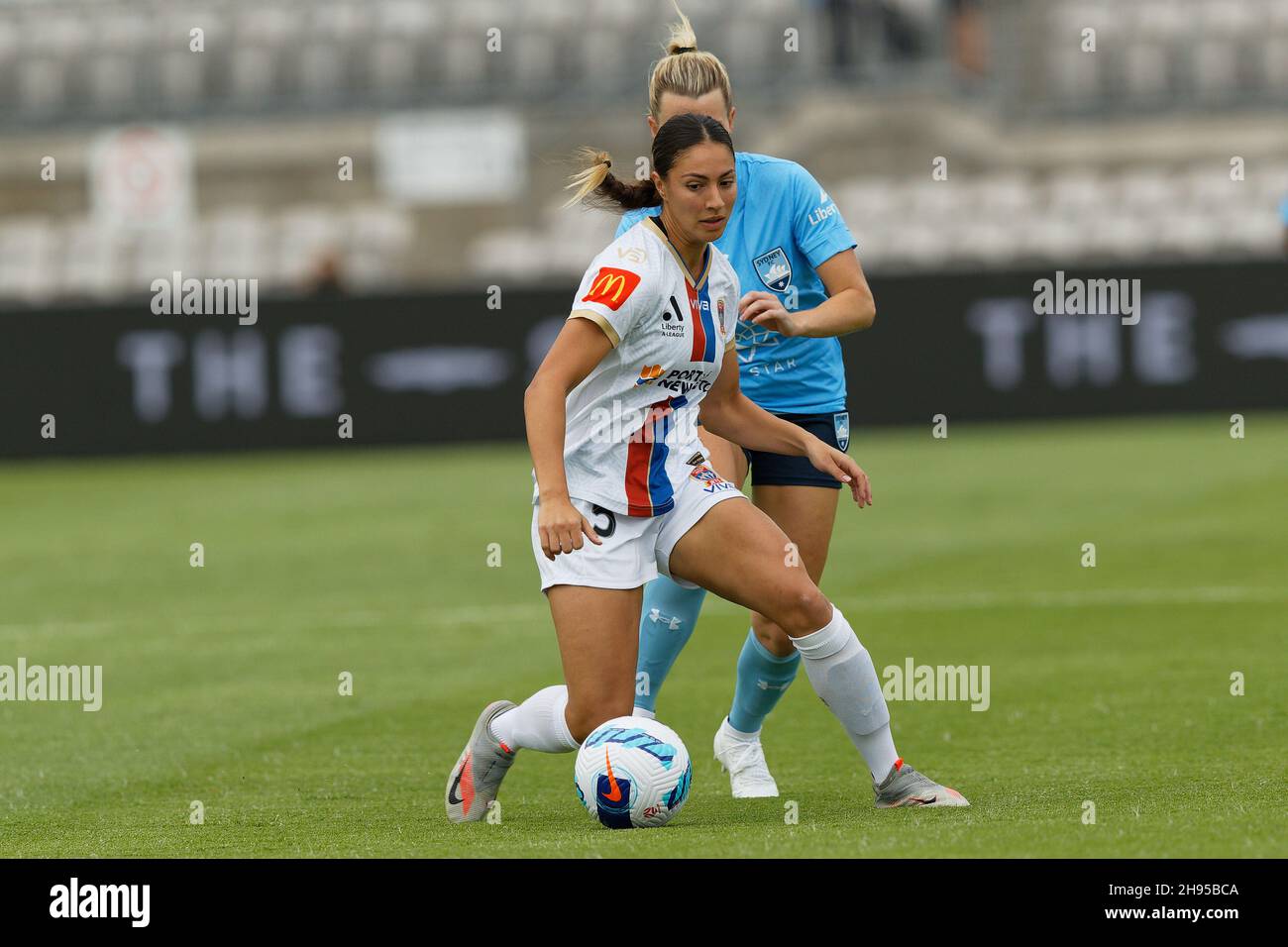 Ally Green of Sydney FC challenges Tiana Jaber of the Newcastle Jets ...
