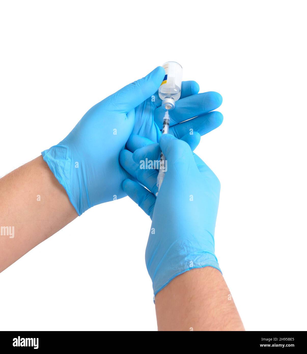 Taking drugs or vaccines into a syringe. Isolated on white background ...