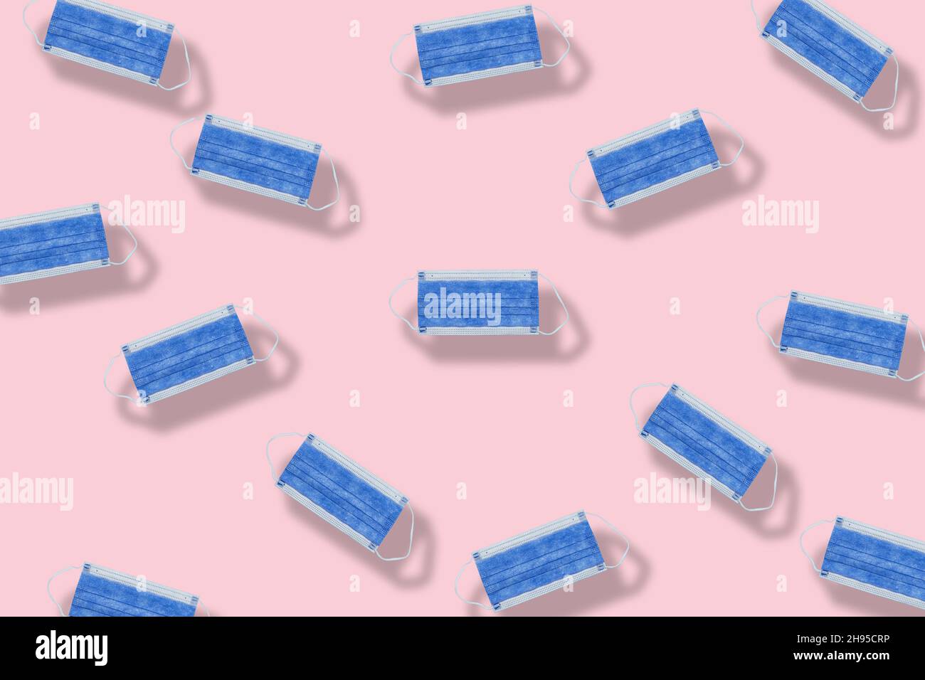 Blue face masks with shadow isolated on light pink background Stock ...