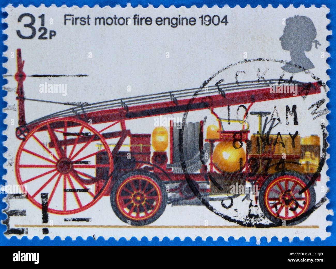Photo of a 31/2p postage stamp depicting the first motor fire engine ...