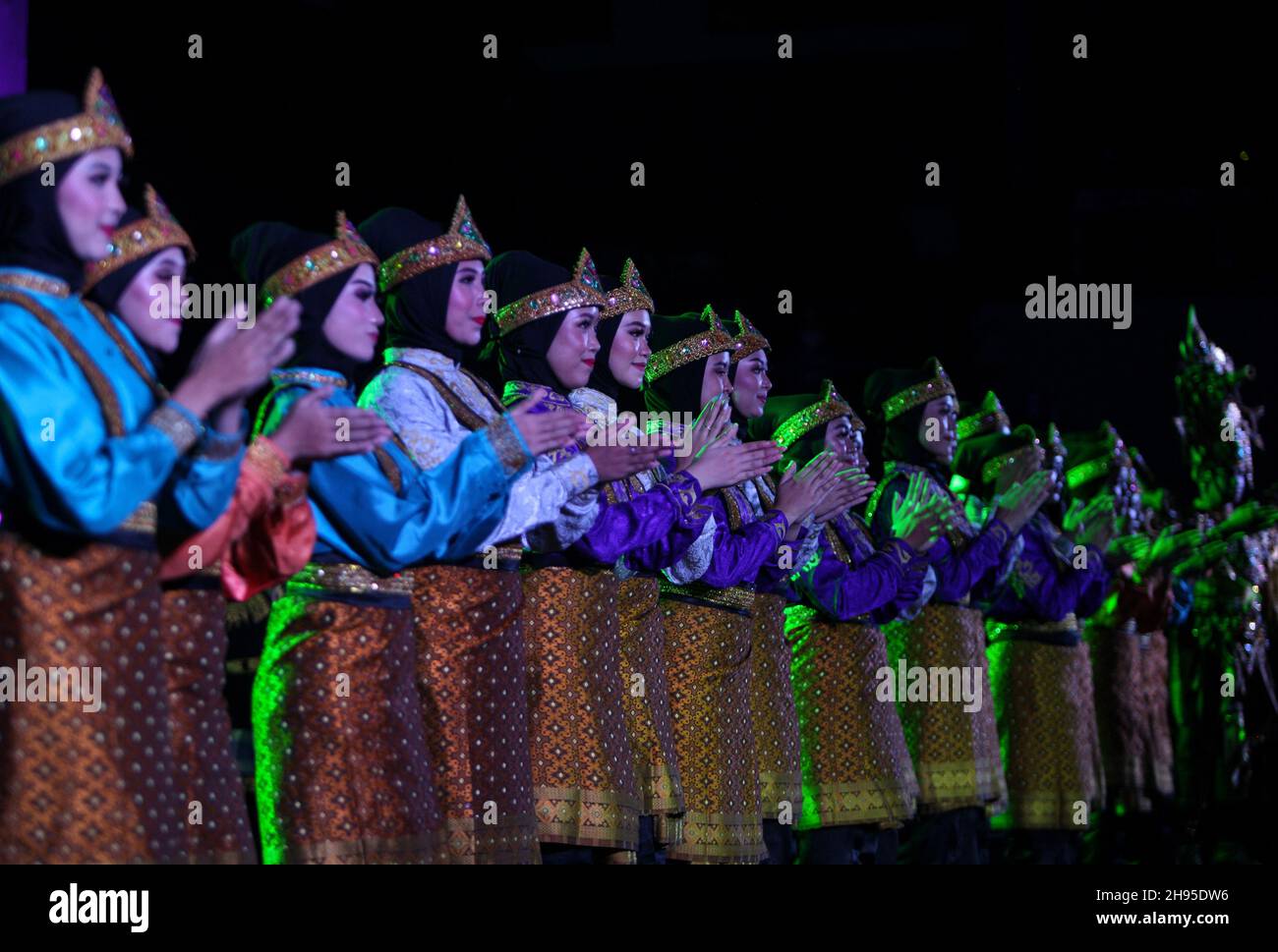 A group dancers perform Saman dance, a traditional Indonesian dance ...