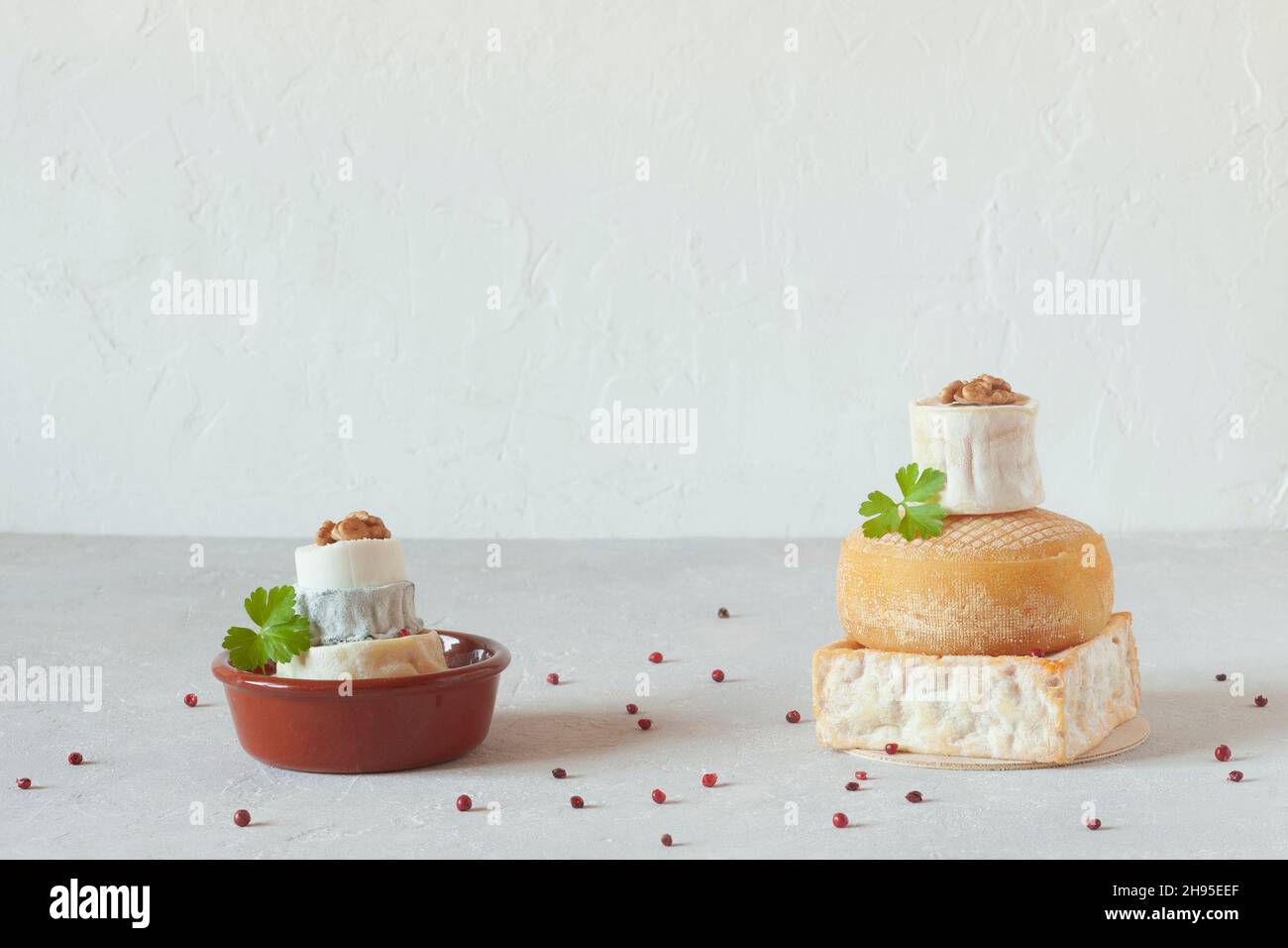 Towers made of different types of cheese, side view Stock Photo - Alamy