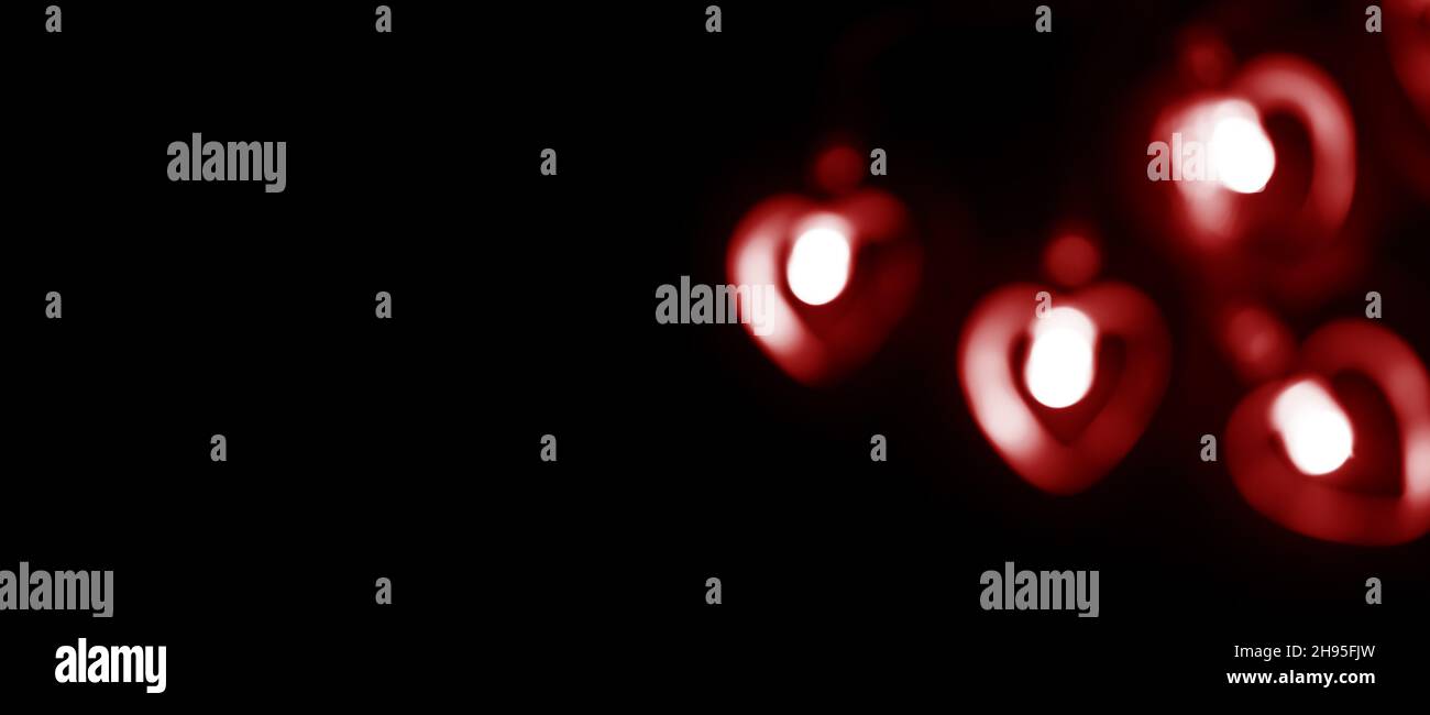 Black banner. Four red blurry lights in the shape of a heart. Copyspace ...
