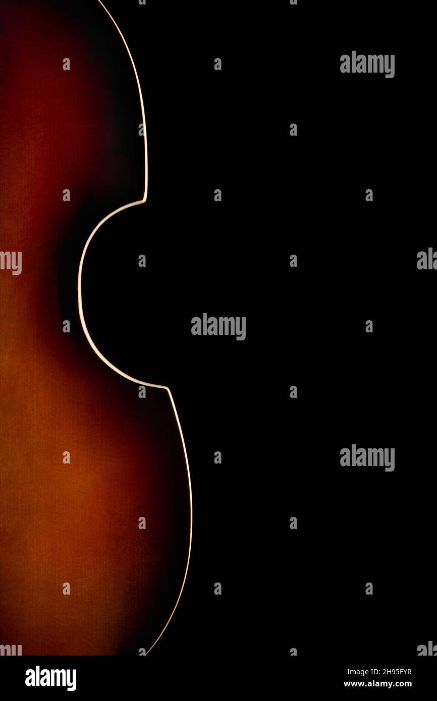 Back of sunburst bass guitar on left side of image on black background ...