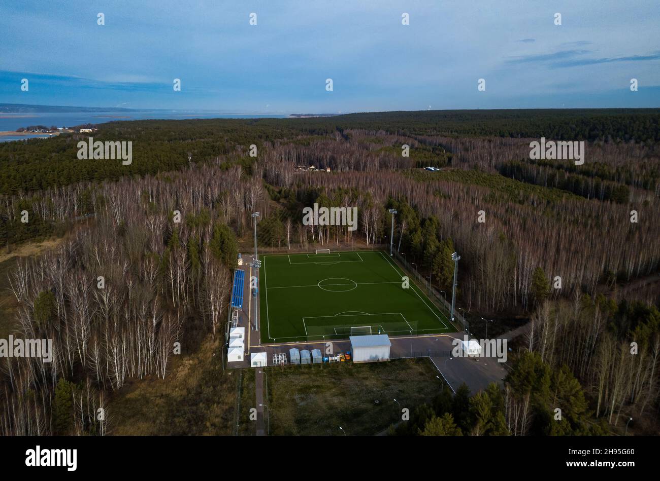 A football pitch in the middle of a forest. Aerial view. Drone view ...