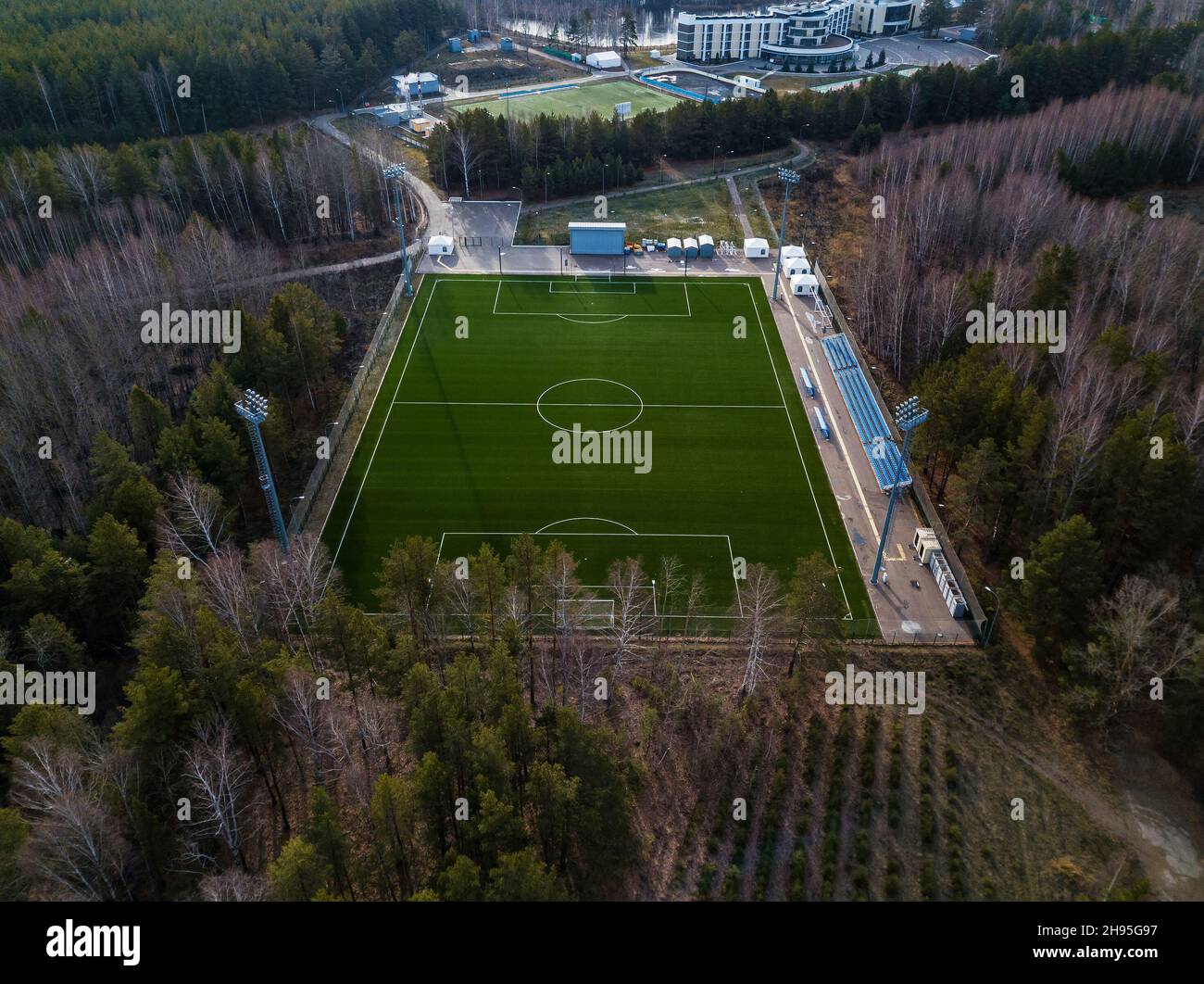 A football pitch in the middle of a forest. Aerial view. Drone view ...