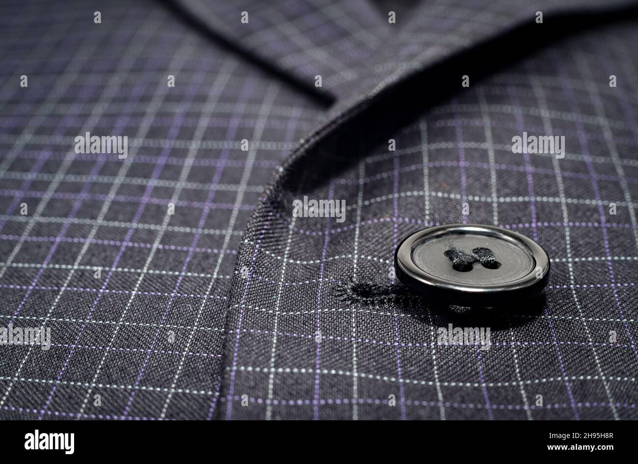 A button on a man's suit close-up. Element of men's clothing. Buttons ...