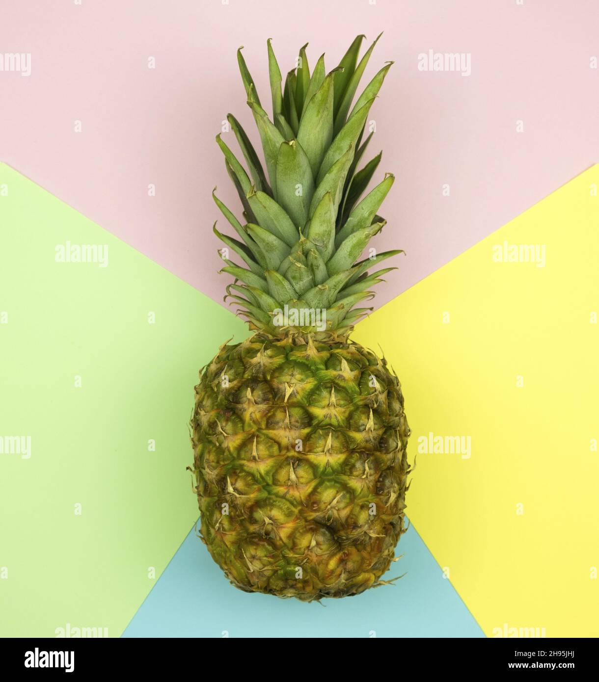 Closeup of a pineapple on a pastel-color background Stock Photo - Alamy